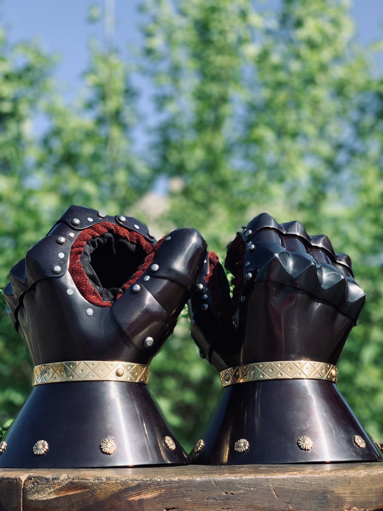 “Black Taurus” gauntlets with golden decoration (tempered steel ...