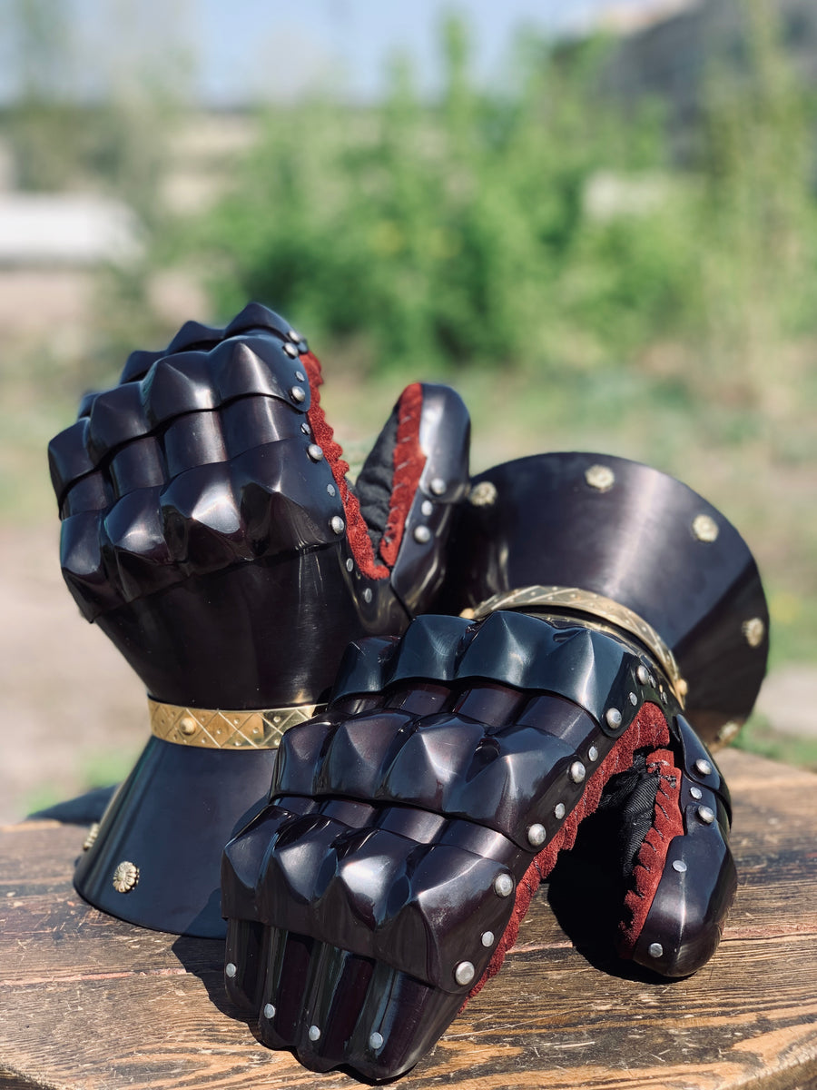 “Black Taurus” gauntlets with golden decoration (tempered steel ...