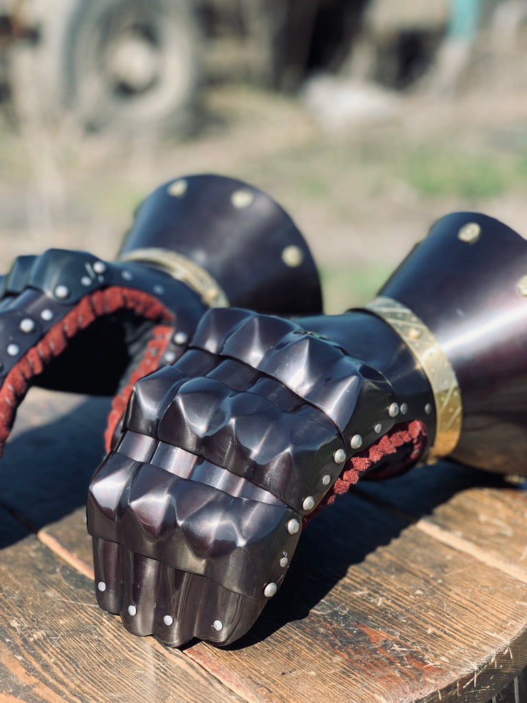 “Black Taurus” gauntlets with golden decoration (tempered steel ...