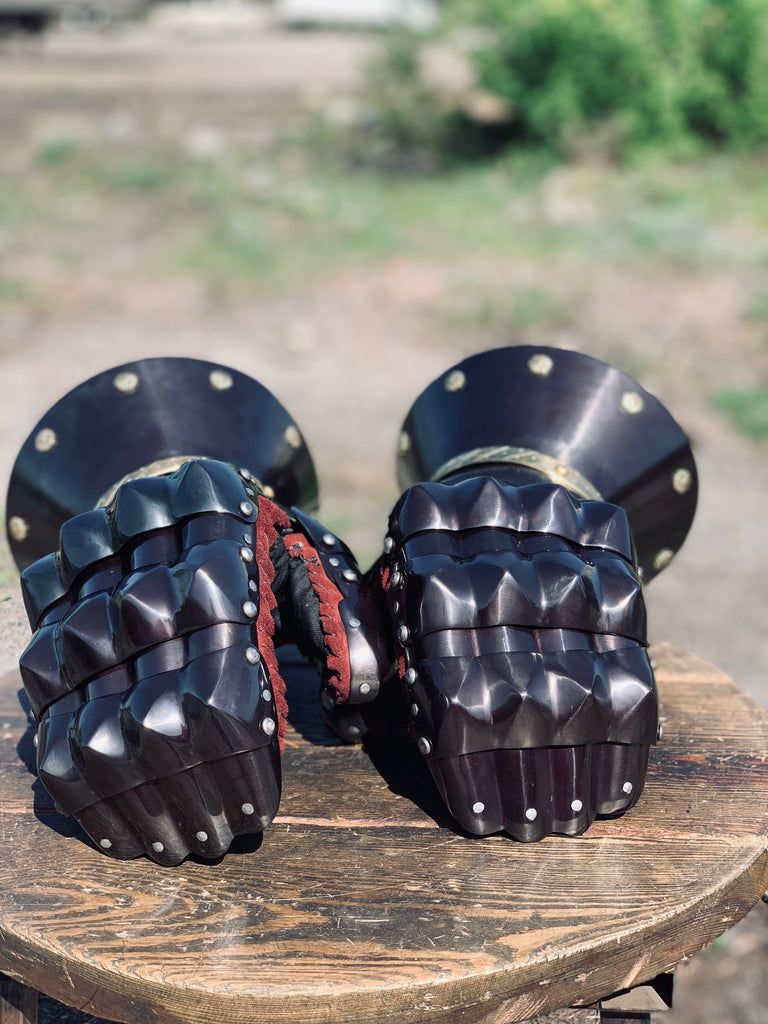 “Black Taurus” gauntlets with golden decoration (tempered steel ...