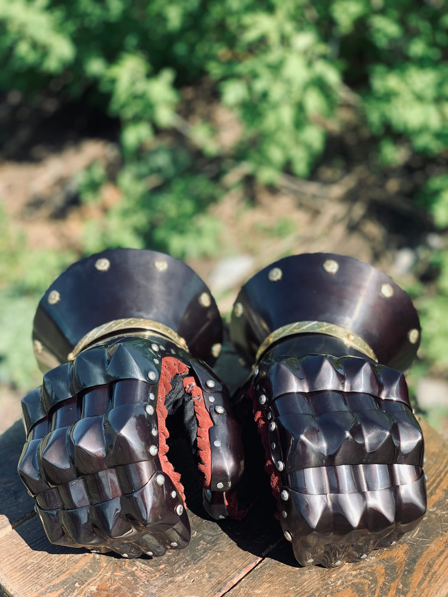 “Black Taurus” gauntlets with golden decoration (tempered steel ...